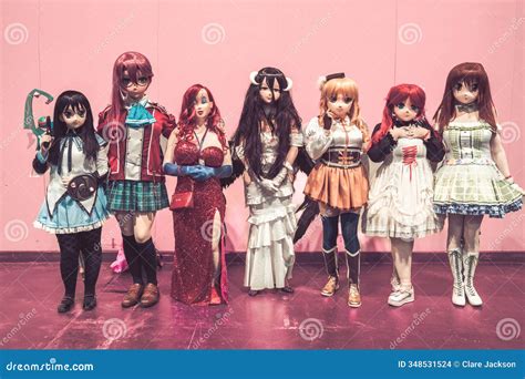 A Group Of Male And Female Cosplayers Dressed As Anime Kigurumi