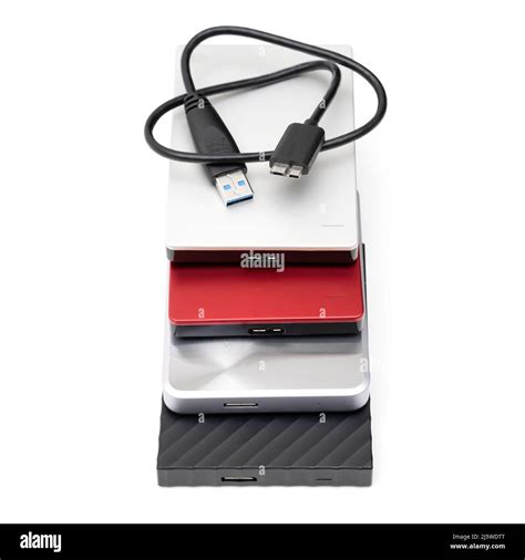 Selection Of Various Portable Hard Disk Drives With A Connection Cable Isolated On White