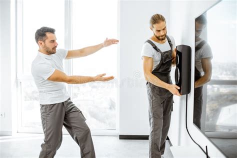 Workmen Installing Audio System At Home Stock Image Image Of Occupation Stereo