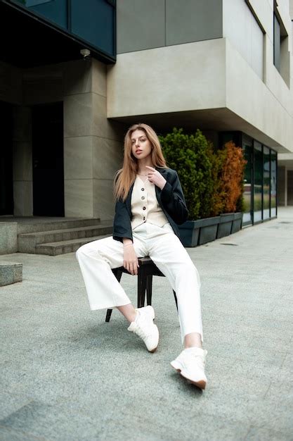 Premium Photo Portrait Of A Beautiful Girl In A Business Suit In The City