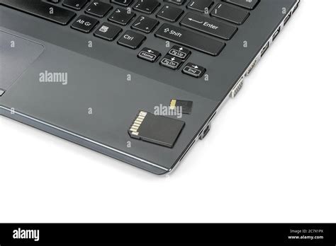 Memory Card And Adapter On Laptop Isolated On White Background With Clipping Path Stock Photo