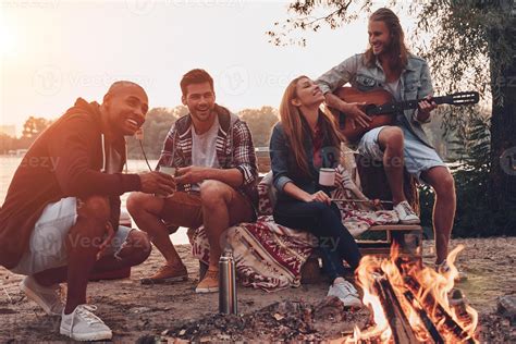 Carefree Camping Group Of Young People In Casual Wear Smiling While