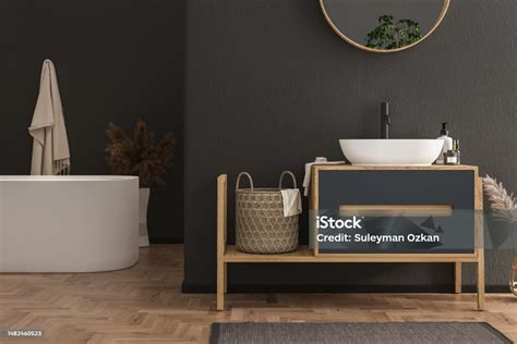 검은색 벽 쪽모이 세공 마룻바닥 흰색 세면대 검은색 수도꼭지 욕조가 있는 세련된 이탈리아식 욕실입니다 수건 마른 식물 깔개가 포함되어 있습니다 모형 사진에 이상적입니다 3d