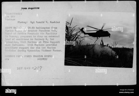 A Ch 53 Helicopter From Marine Heavy Helicopter Squadron 463 Prepares To Deliver Ammunition To