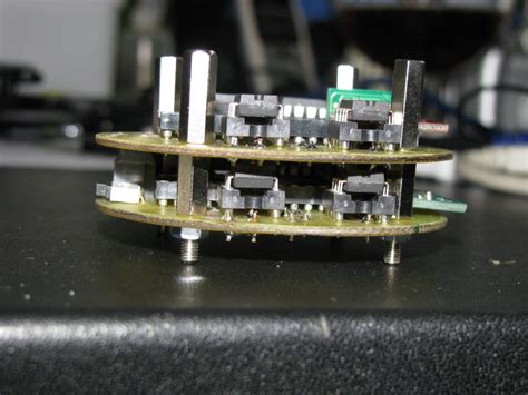 B The 3d Accelerometer Red On Its Doublesided Pcb Resting On Top Of Download Scientific
