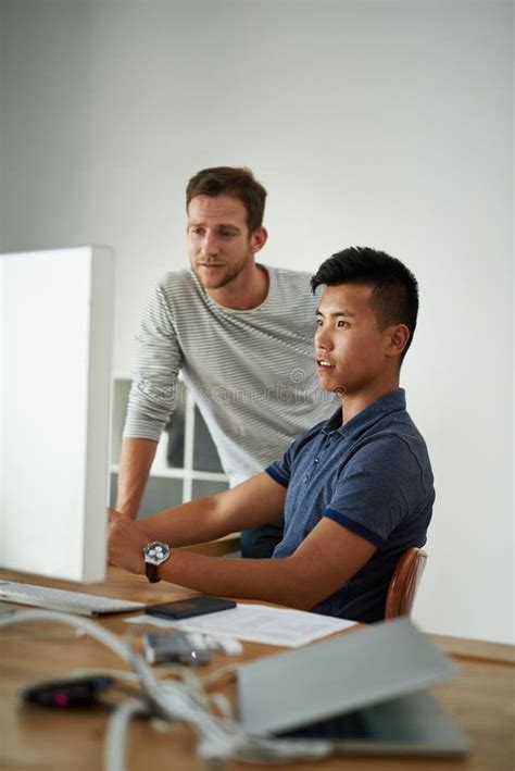 Interestingtwo Designers Working Together On A Project In An Office Stock Image Image Of