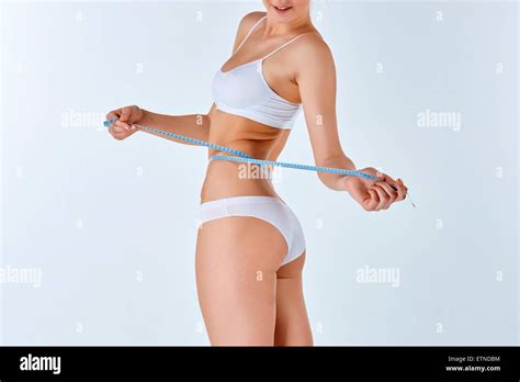 Woman Holding Meter Measuring Perfect Shape Of Her Beautiful Body Stock Photo Alamy