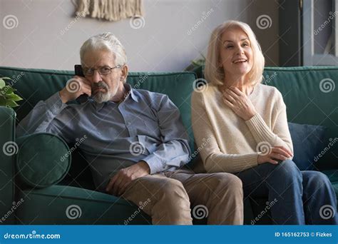 Elderly Wife Soap Opera Lover And Annoyed Husband Watching Television