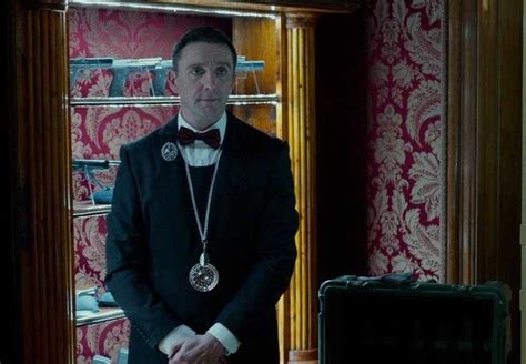 In John Wick 2 The Silver Badge Worn On The Sommelier Collar Meant