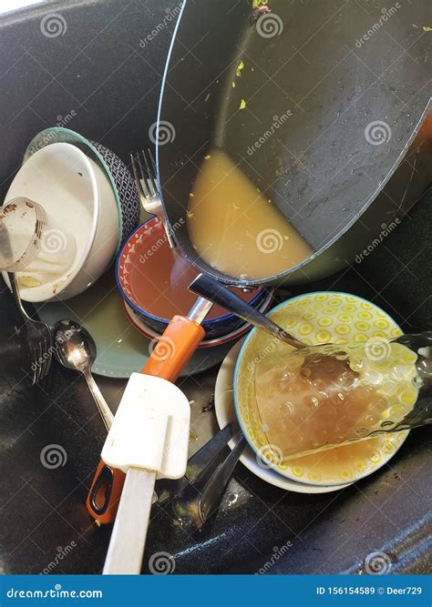 Dirty Dishes Piled In A Kitchen Sink Stock Image Image Of Kitchen