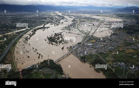 Residential Area Is Covered With Water As The Banks Of Chikuma River