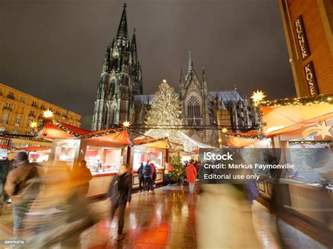 Market Stalls A Christmas Tree And The Cologne Cathedral On The