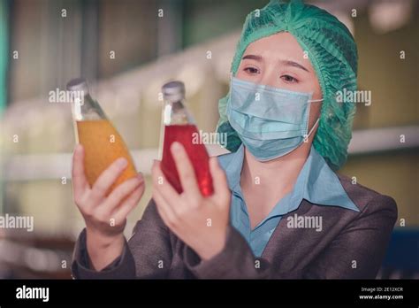 Asian Women Checking Stock Product Beverage In Production Line On Factory For Confirm Quality