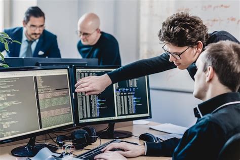 Premium Photo Startup Business Problem Solving Software Developers Working On Desktop Computer