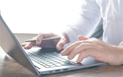 Premium Photo Man Hands Typing Keyboard Laptop Project Manager