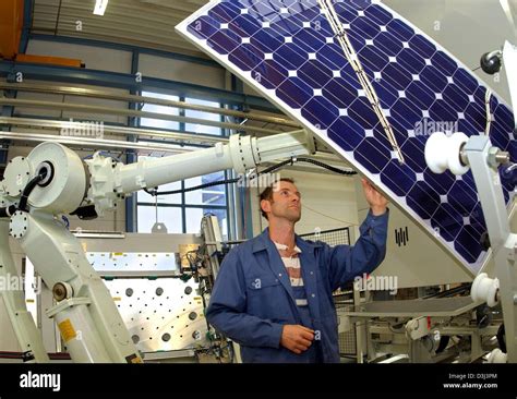 Dpa Werner Strobelt Employee Of Solar Factory Gmbh Examines The Panel Of A Solar Modulus