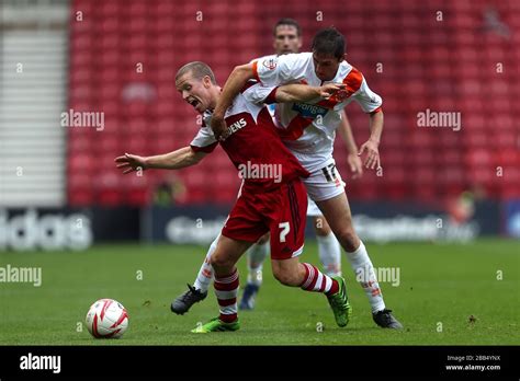 Middlesbroughs Grant Leadbitter Left And Blackpools Chris Basham