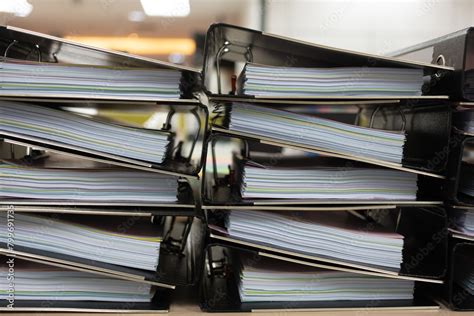 Files Stacked On Filing Cabinet A Large Pile Of Binders Filled With