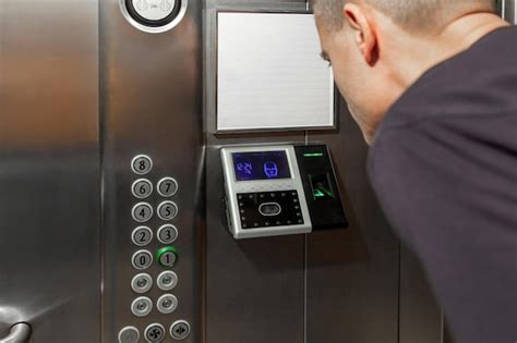 Premium Photo A Man Shows His Face To A Fingerprint Access Control Terminal With A Facial