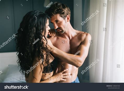 Romantic Young Couple Being Intimate Sensual 스톡 사진 1248640168