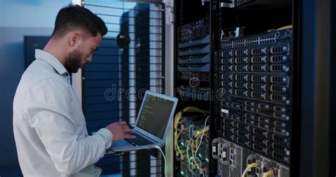 man laptop and coding in server room with programming cybersecurity
