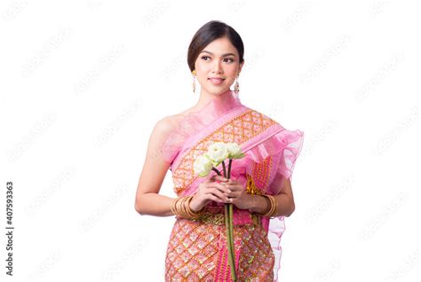 Portrait Of Beautiful Thai Girl In Traditional Costume With A Lotus