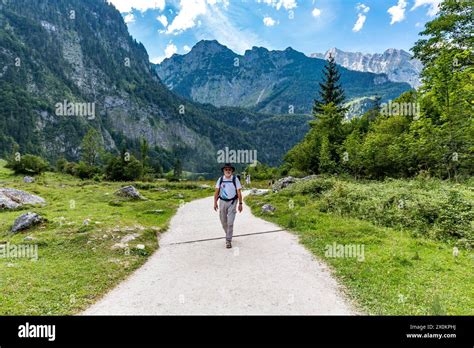 Tourist On The Hiking Trail From Saletalm To Obersee Königssee Behind