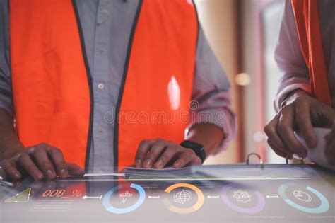 Engineer Or Foreman Using Tablet And Pen Presenting Virtual Chart