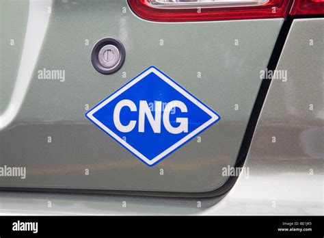A Close Up Of Cng Compressed Natural Gas Stickers On A Honda Civic