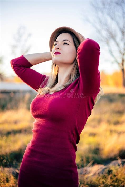 Cute Girl In Red Dress With Old Fashion Hat Retro Vibes In A Fall Scene