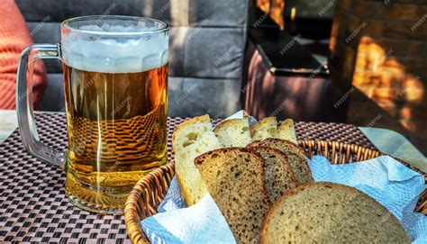 Premium Photo Beer In A Typical Glass Draft Beer With A Light Snack