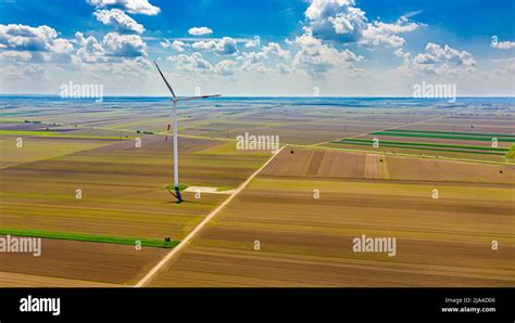 Above View On Farm Of Large Wind Power Turbines Are Standing Among