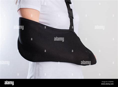 A Girls Arm In A Black Support Bandage After A Broken Arm And Sprained