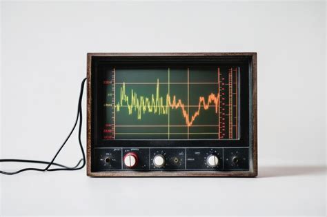 Vintage Oscilloscope Capturing Vibrant Waveforms In A Serene Minimalist Setting Premium Ai