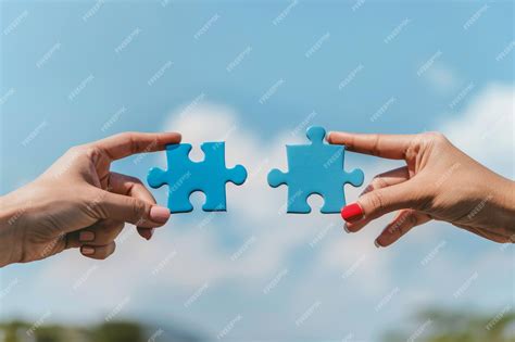 Two Hands Connecting Puzzle Pieces Symbolizing Teamwork And Growth Premium Ai Generated Image