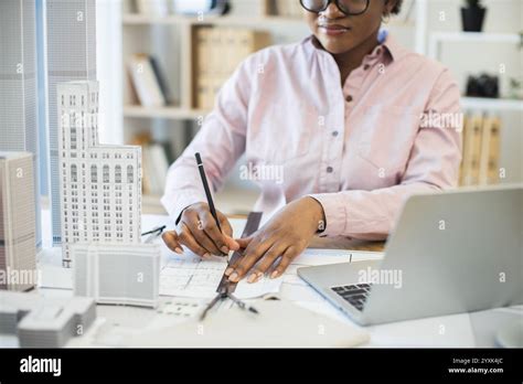 African Woman Architect Focused On Drawing City Blueprint With Scale Models Professional