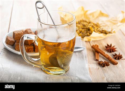 Hot Chamomile Tea Made Of Wild Flowers With A Mesh Ball Tea Infuser