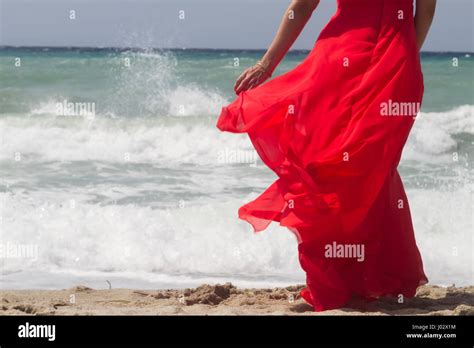 Beautiful Red Dress Flowing In The Wind At The Beach Cropped Soft