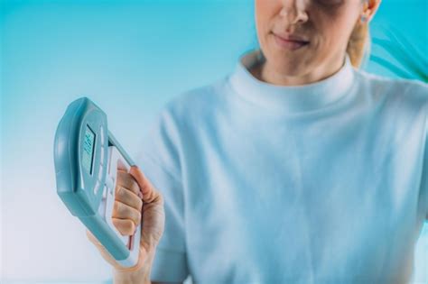 Premium Photo Using Hand Dynamometer Entering Values Into Smart Phone App