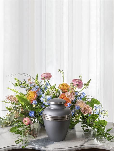 Funeral Flowers Around Urn At Caitlyn Lavater Blog