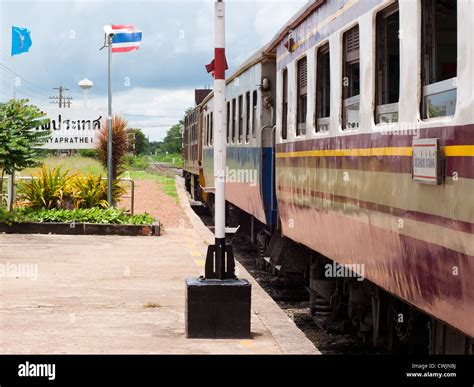 Passenger Train With 3rd Class Cars Waiting At The Station In