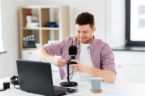 premium photo male audio blogger connecting cable to microphone