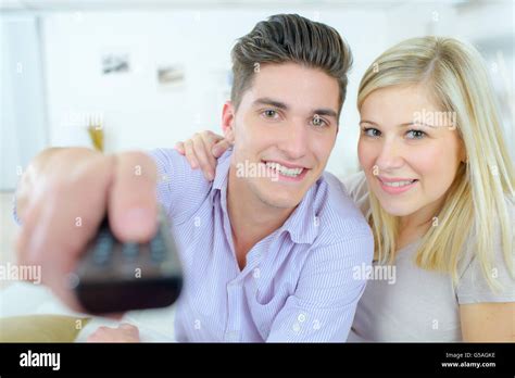 Couple Using A Remote Control Stock Photo Alamy
