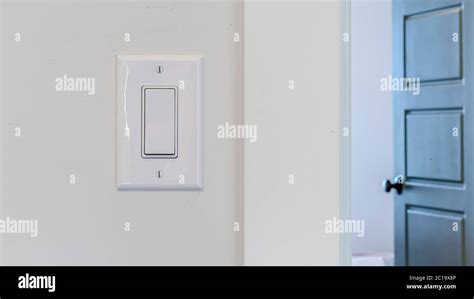 Panorama Frame Electrical Rocker Light Switch On White Wall Against