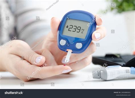 Woman Use Glucometer Checking Blood Sugar Stock Photo 2450985931 Shutterstock