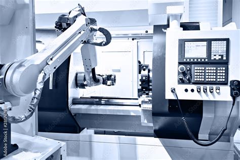 Robotic Arm And Cnc Lathe Stock Photo Adobe Stock