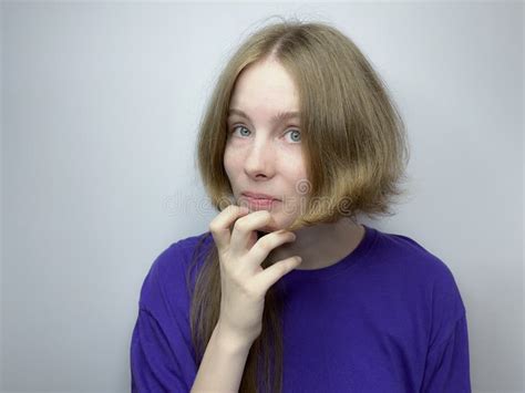 A Sempotic Amazed Girl Presses Her Hand To Her Mouth Stock Photo Image Of White Isolated