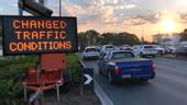 Illuminated Led Construction Sign Notifying Drivers On A Busy Road Of