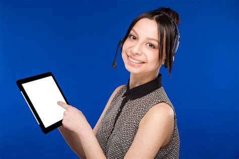 Premium Photo Girl With A Headset And A Tablet