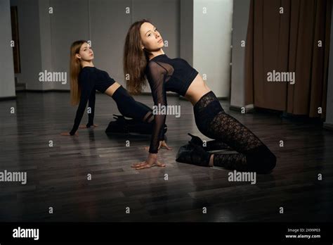 Duet Of Dancers Performing Floorwork Routine During Stiletto Workout